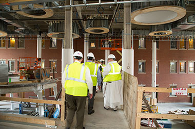 Fr. Shanley and Cabinet members tour the site with Mark Rapoza and Tim ...